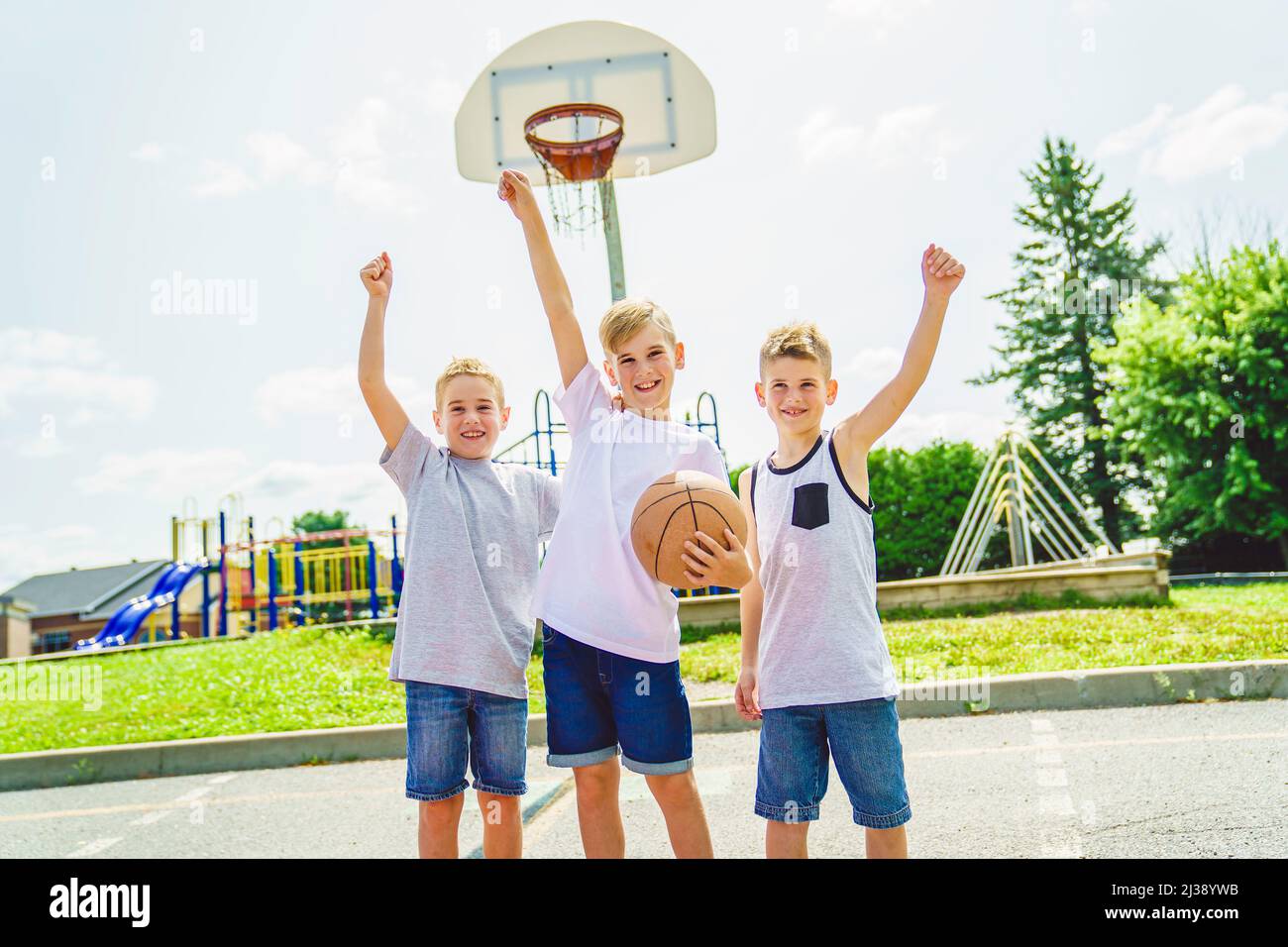 Young Boys brother Playing Basketball on the summer time Stock Photo ...