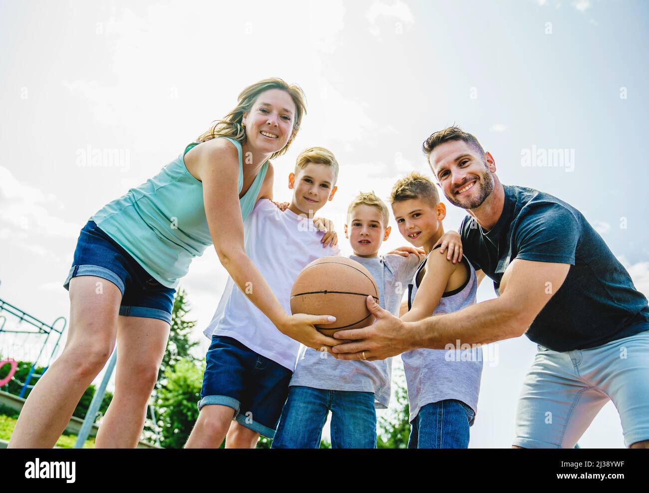 Happy basketball family portrait play this sport on summer season Stock ...