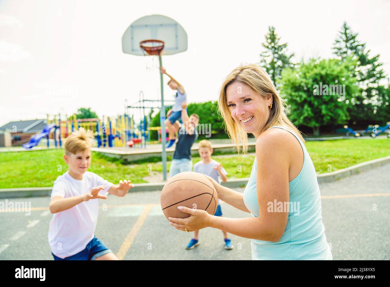 Happy basketball family portrait play this sport on summer season Stock ...