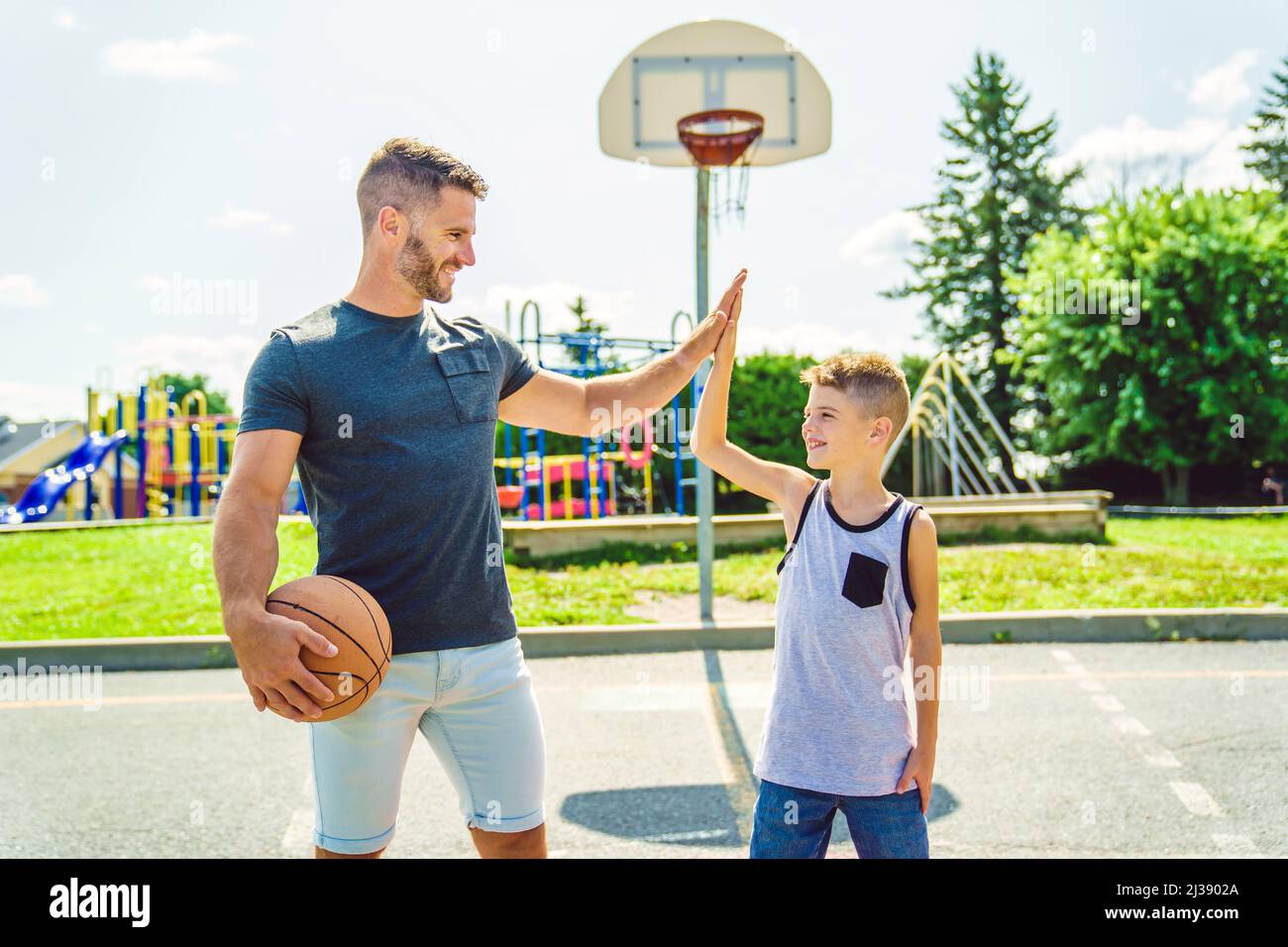 Happy basketball family portrait play this sport on summer season. The ...