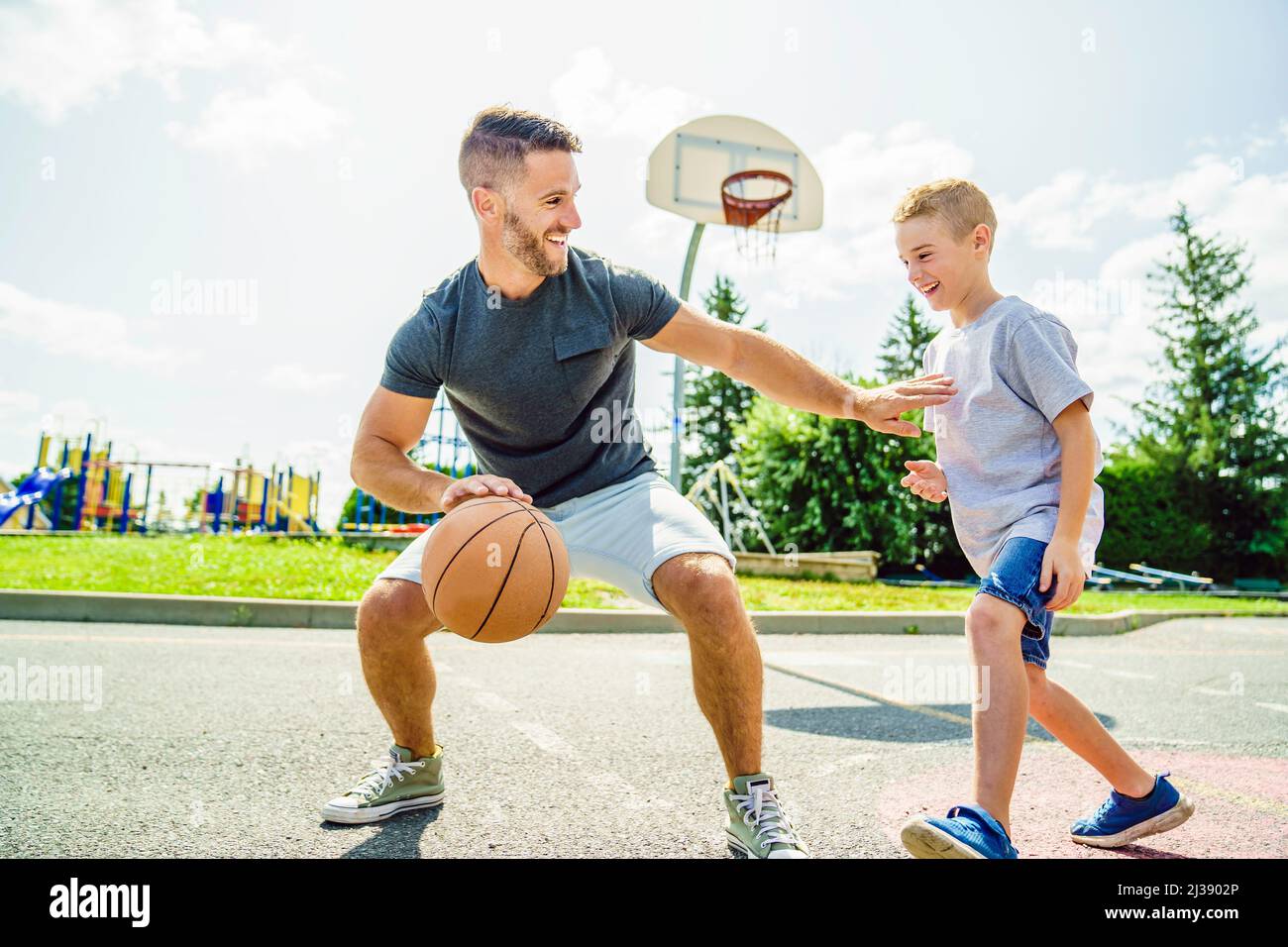 Happy basketball family portrait play this sport on summer season. The ...