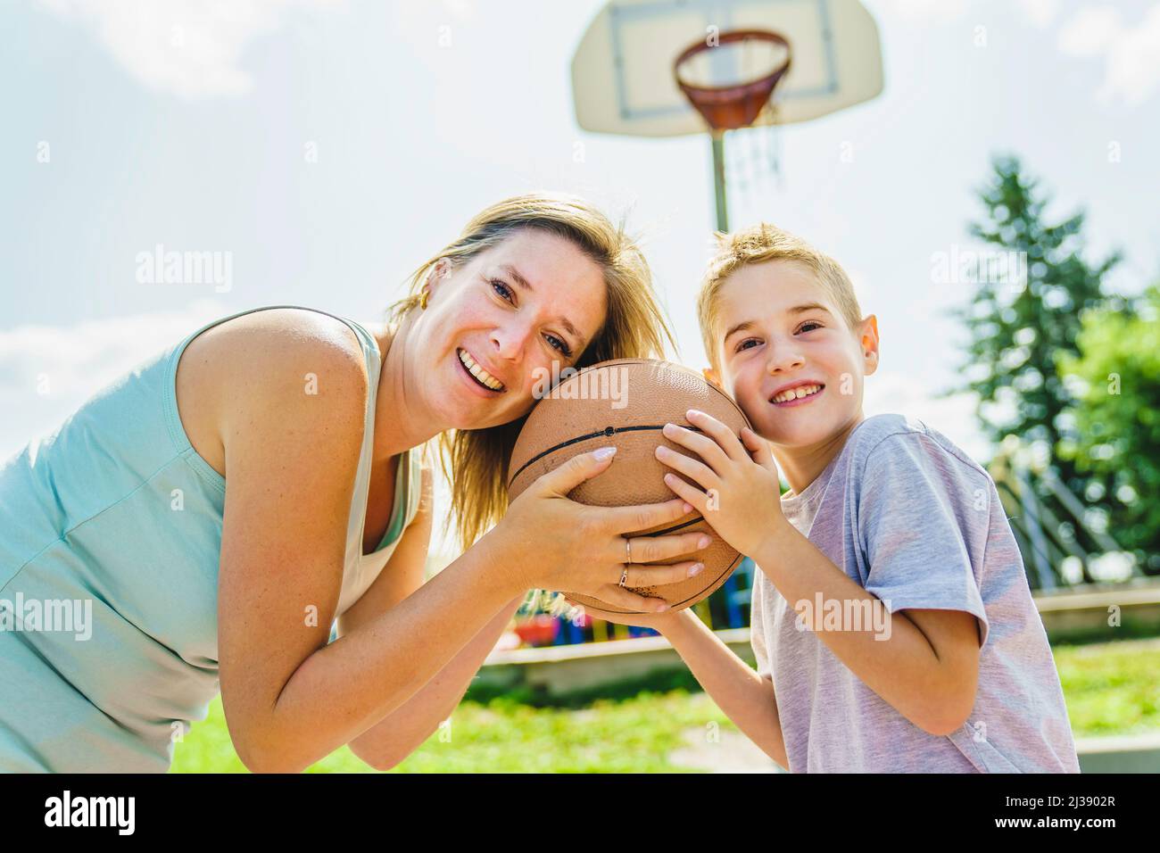 Happy basketball family portrait play this sport on summer season. The ...