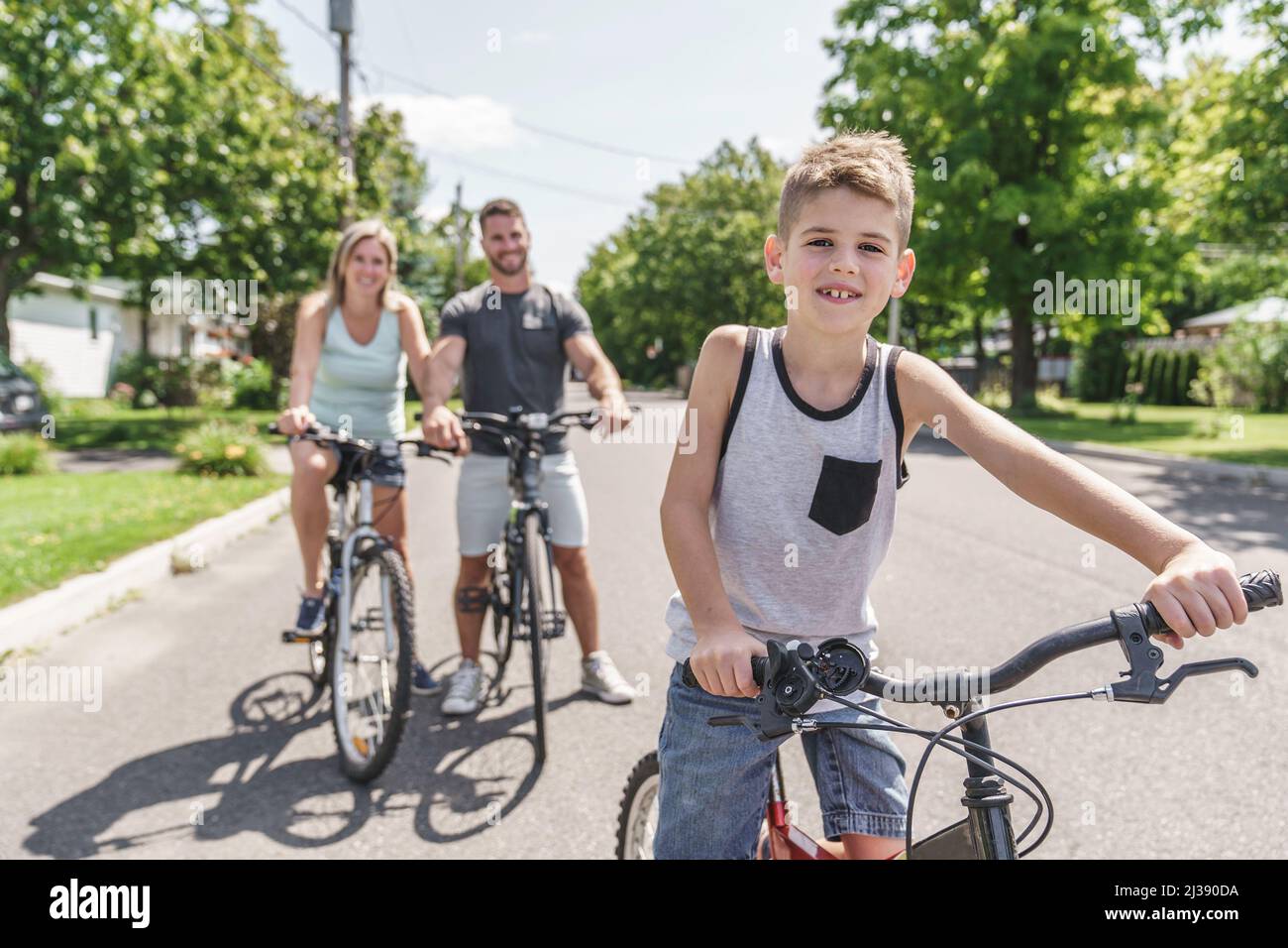 Young family on country bike ride on the summer season Stock Photo - Alamy