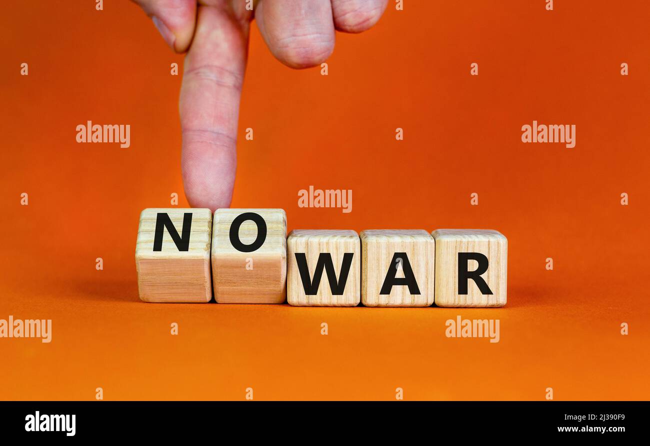 No war symbol. Businessman turns cubes and changes concept words War to ...