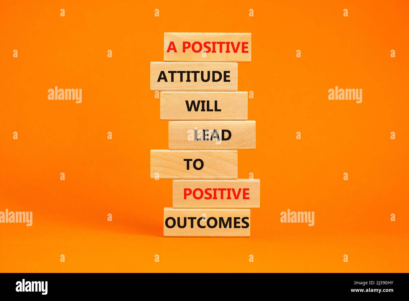 Think positive symbol. Wood blocks with words A positive attitude will ...