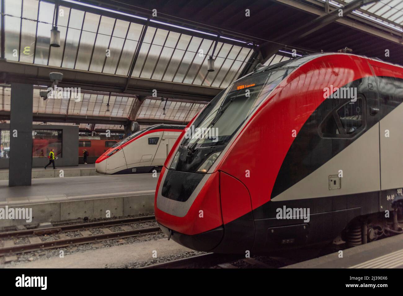 Red fast high speed train in Zurich station in south of Switzerland ...