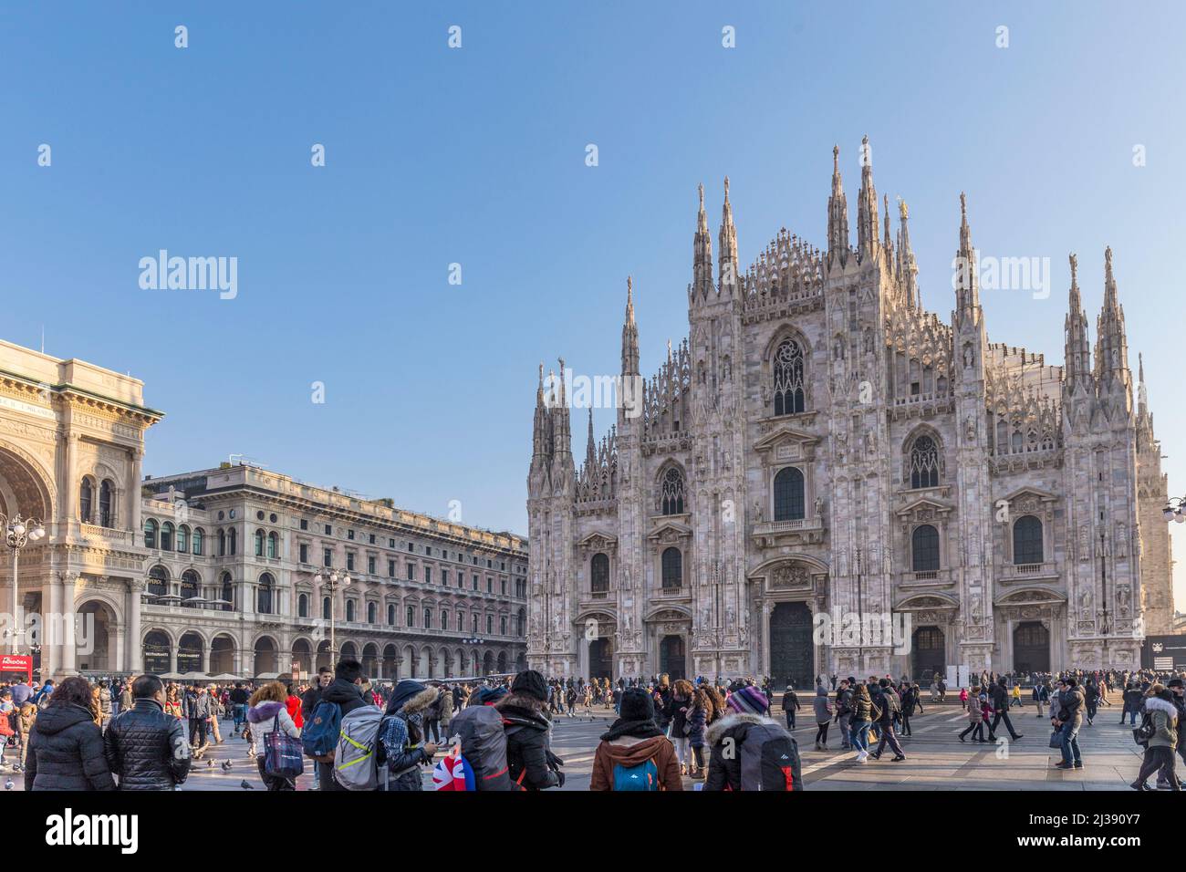 MILANO, ITALY - JAN 3, 2017: people visit the Milan Duomo under blue ...