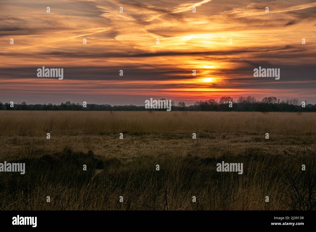 A view of a beautiful sunset painting the sky red and orange over a ...