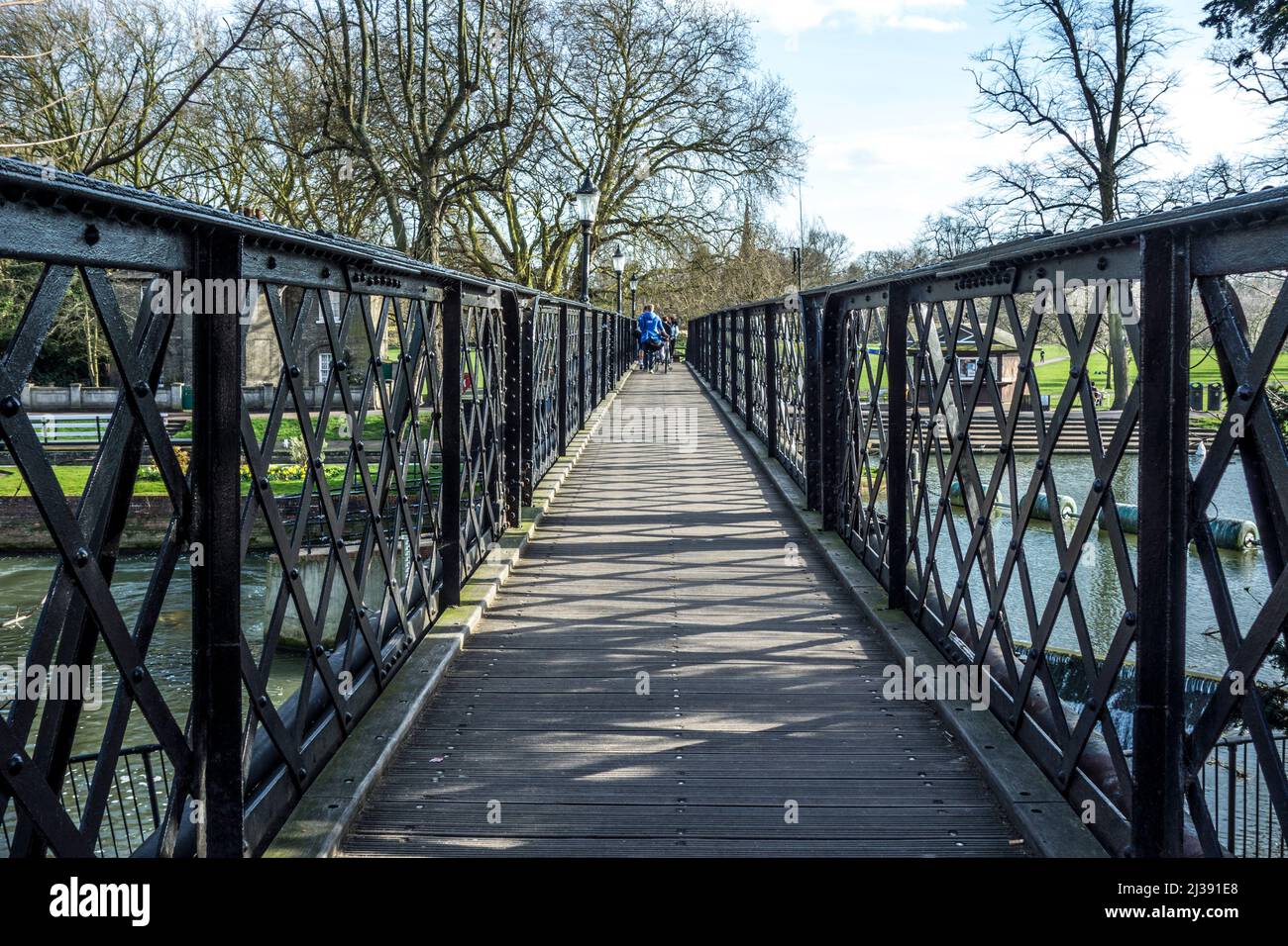 CAMBRIDGE, ENGLAND - MAR 13, 2017: people crossing the river cam at an ...