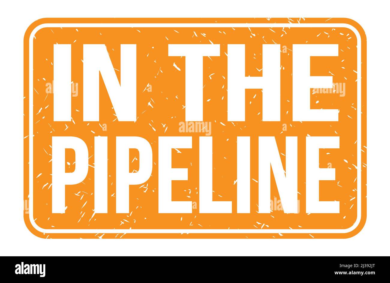 IN THE PIPELINE, words written on orange rectangle stamp sign Stock ...