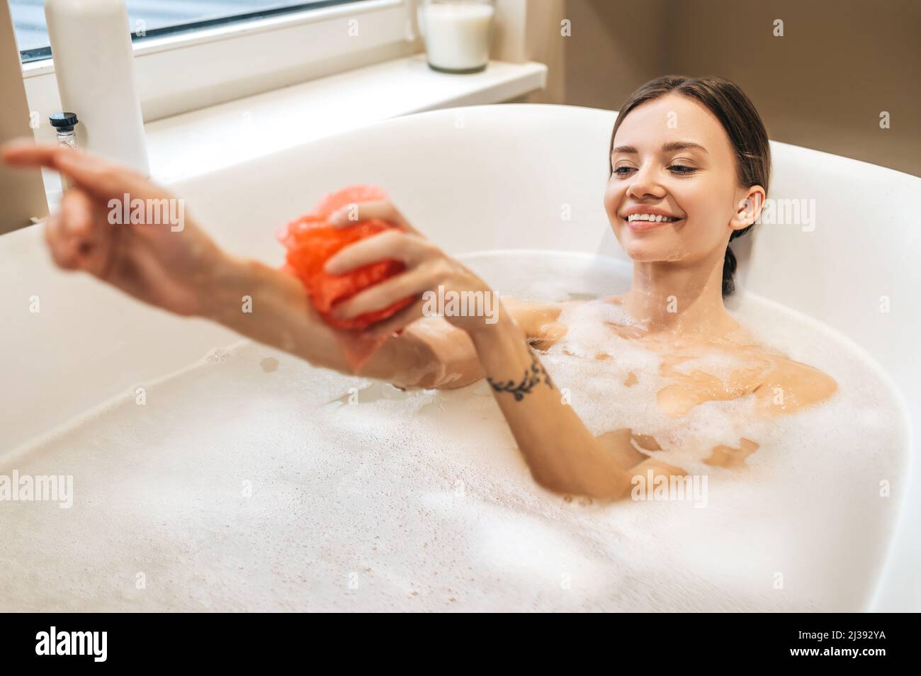 Young woman washing herself body hi-res stock photography and images ...