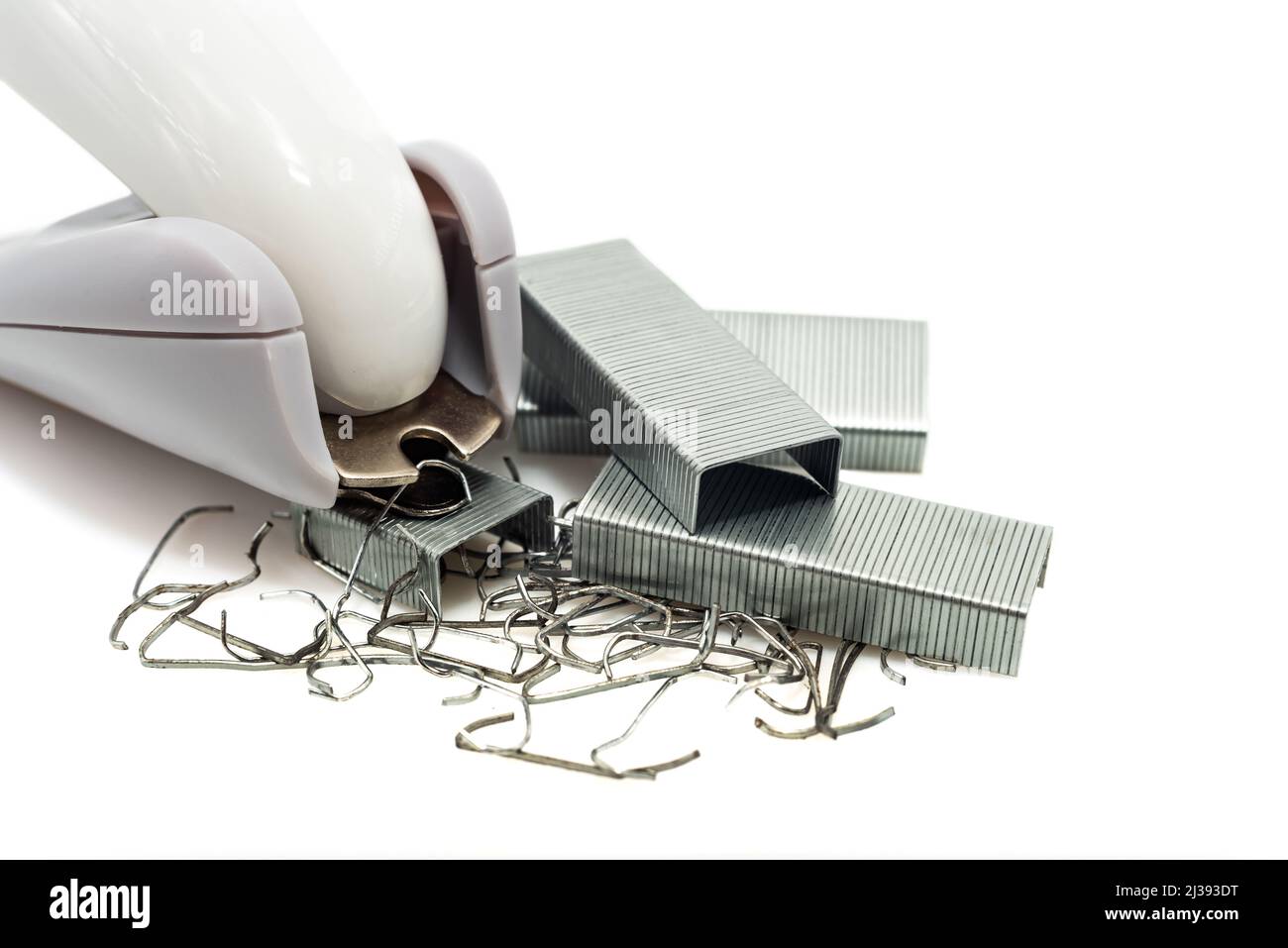 Anti-stapler with clerical staples on a white background. Stationery ...