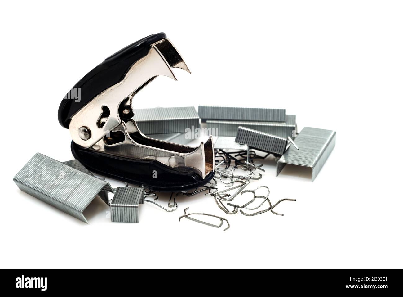 Anti-stapler with clerical staples on a white background. Stationery ...