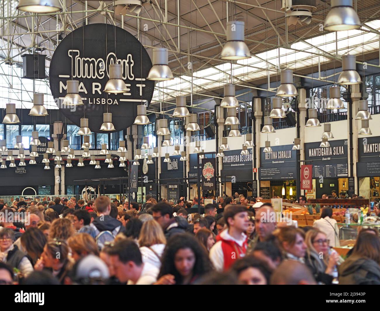 The inside of the Time Out Market full of people Stock Photo - Alamy