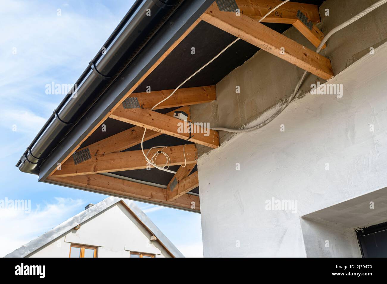Electric socket mounted on the trusses above the garage door, electric ...