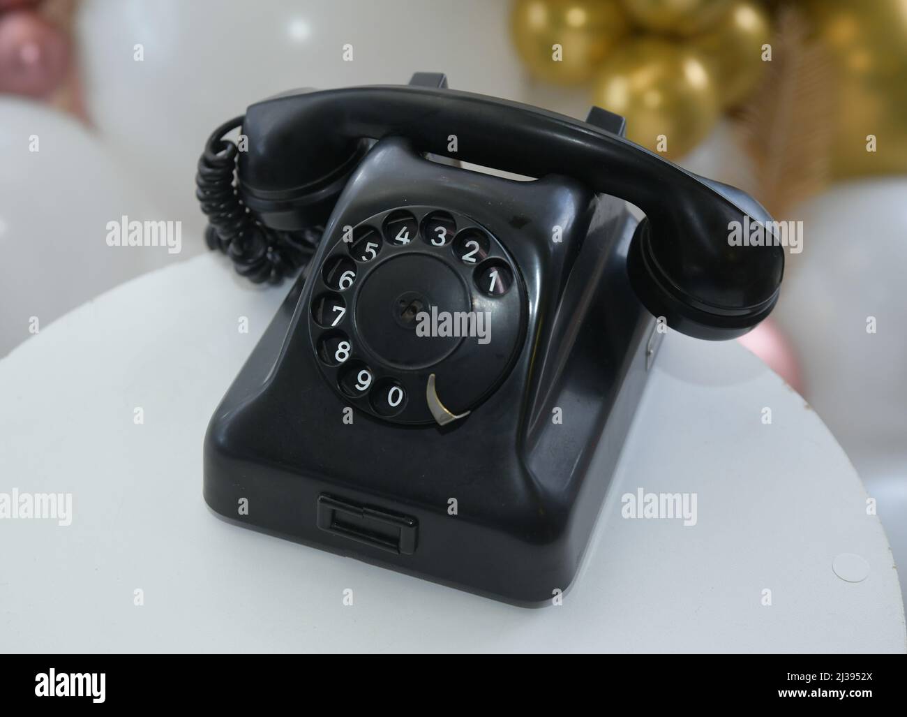 The old black telephone in style of a retro Stock Photo - Alamy