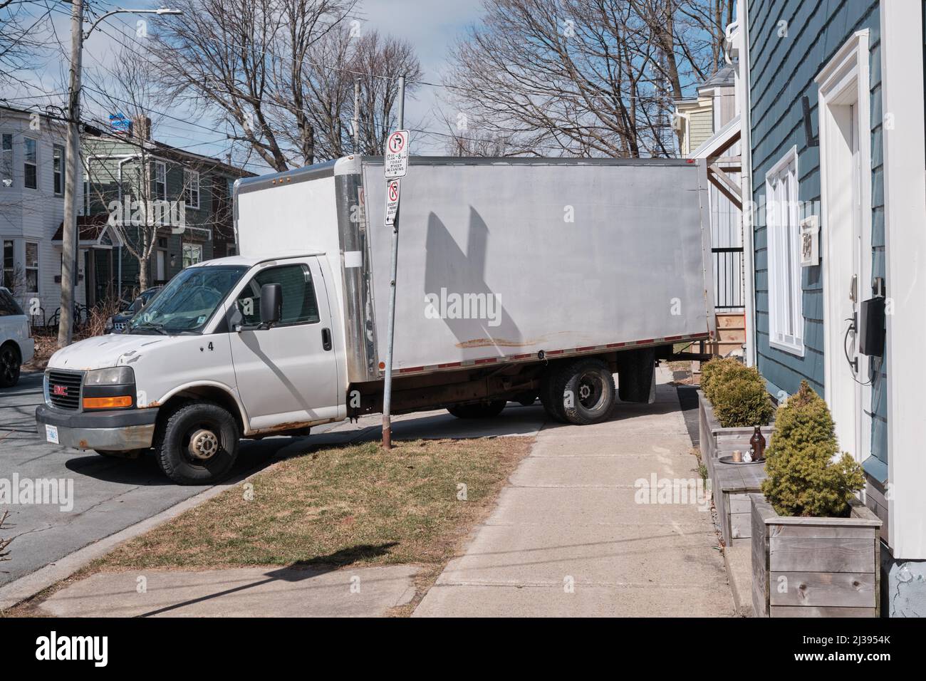 Cube van truck parked illegally over sidewalk blocking access to ...