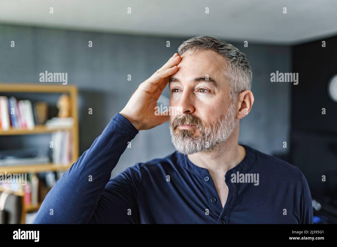 40s or 50s sad and worried man with grey hair Stock Photo - Alamy