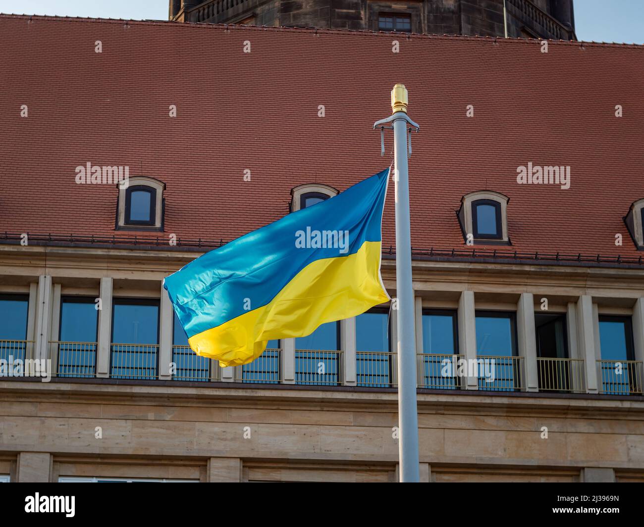 Ukrainian flag in front of the town hall building. Political statement ...