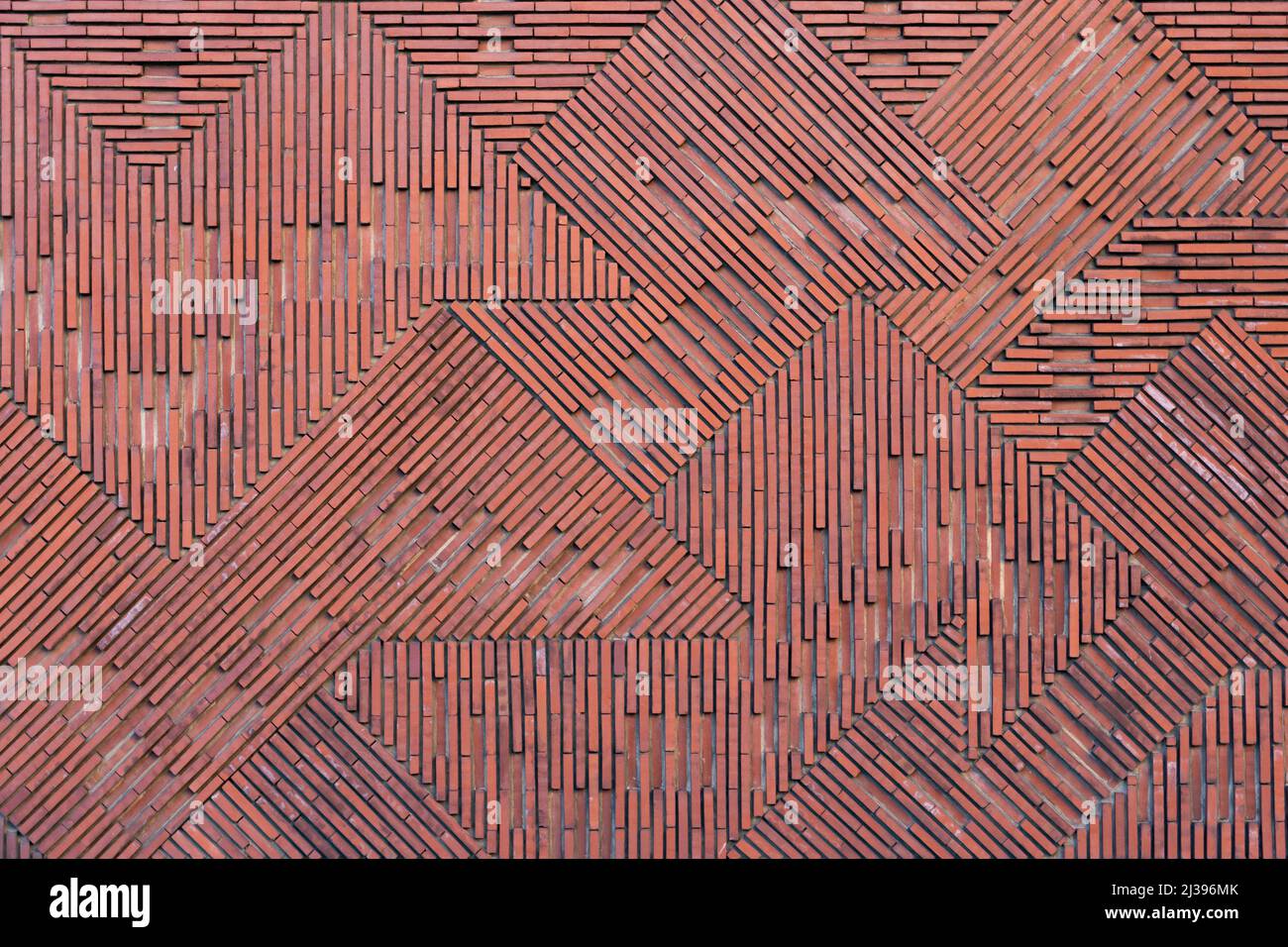 Fine stone wall texture with a relief on the exterior of a building ...