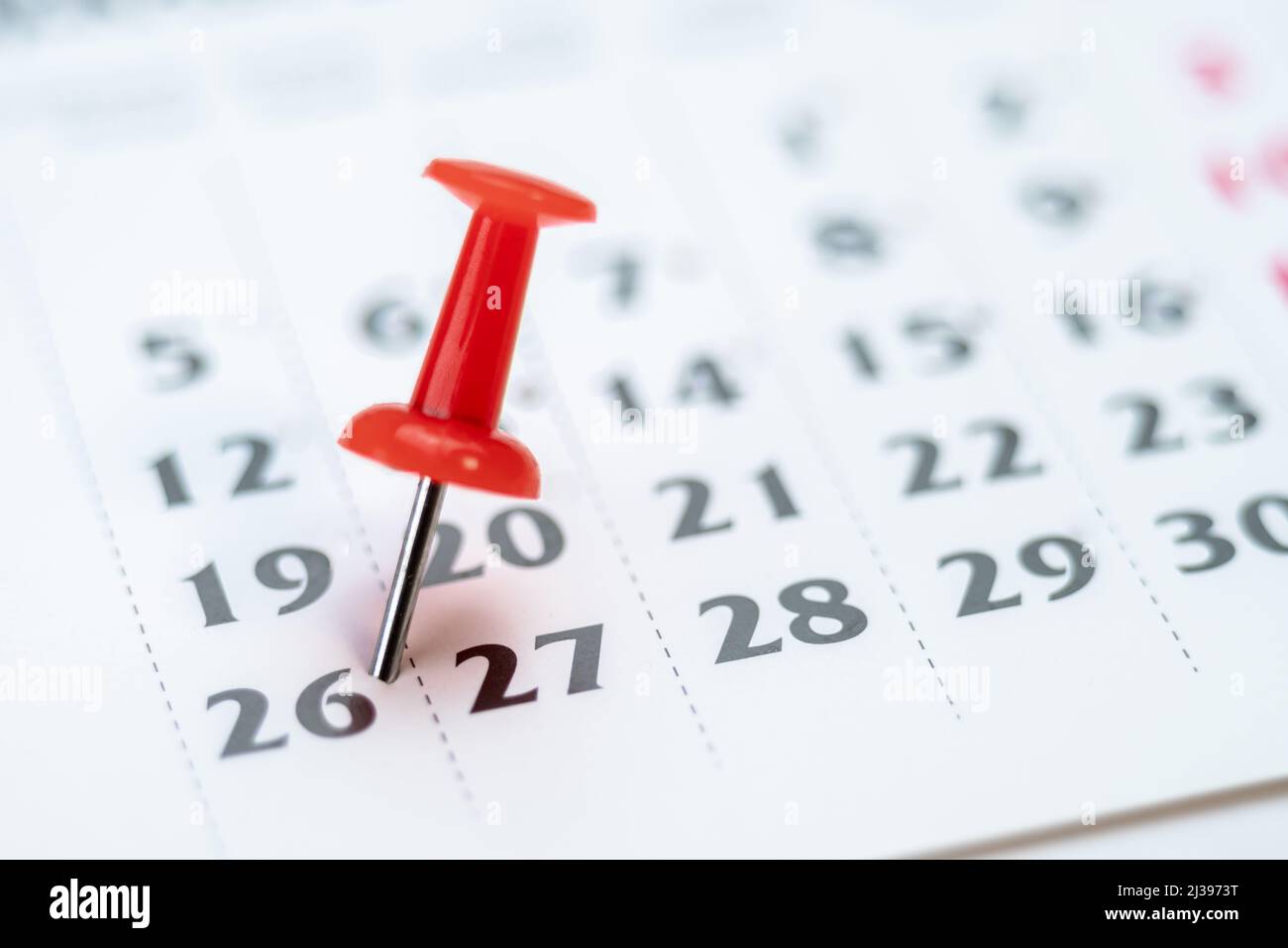 Red push pin on calendar 26th day of the month, mark the Event day with ...