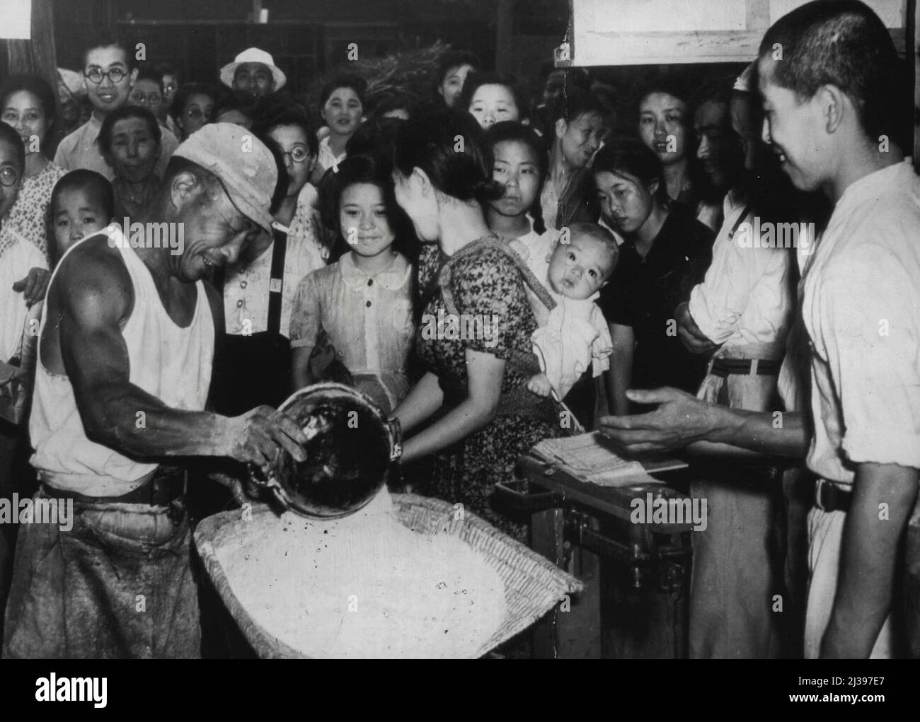 Japanese Receive Flour Milled From U.S. Wheat -- A workman (left ...