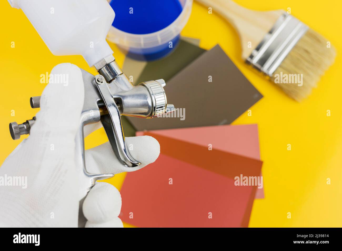 paint spray gun at work at the workplace in the workshop Stock Photo ...