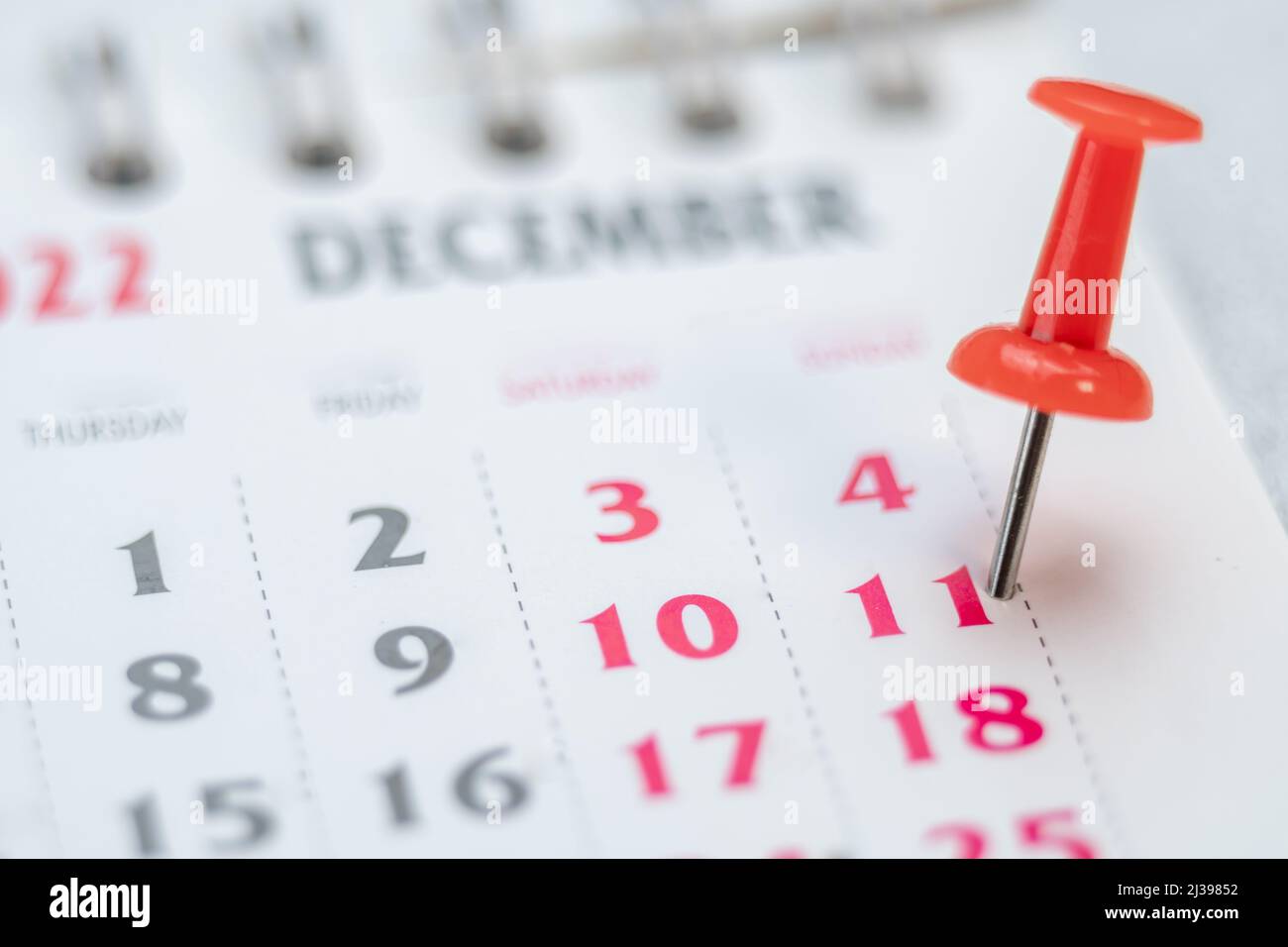 Red push pin on calendar 11th day of the month, mark the Event day with ...