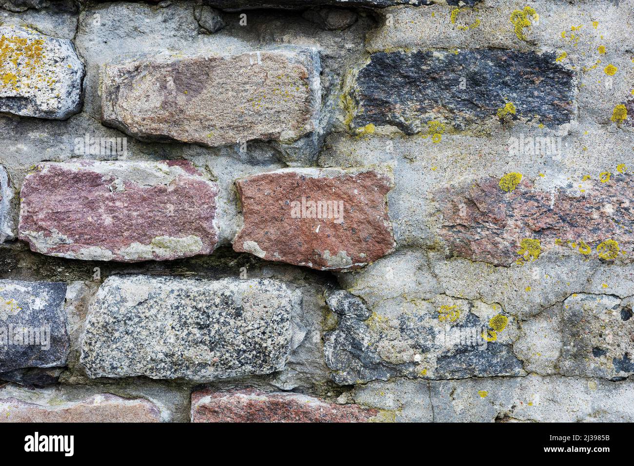 The rough textured surface of the wild stone wall. Background Stock ...