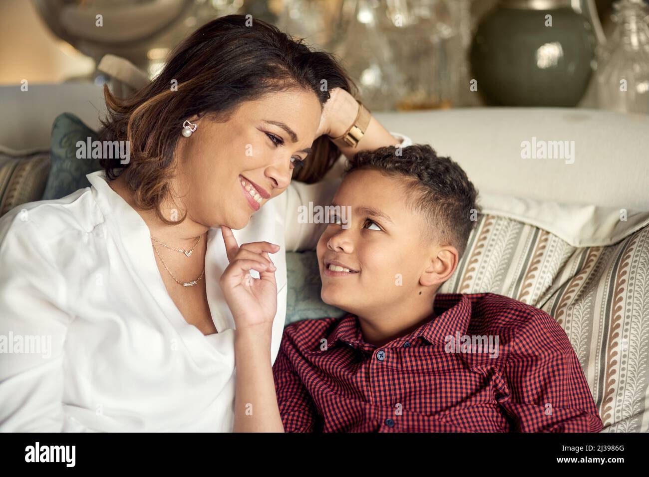 Raising her son to cherish and respect women. Shot of a happy mother ...