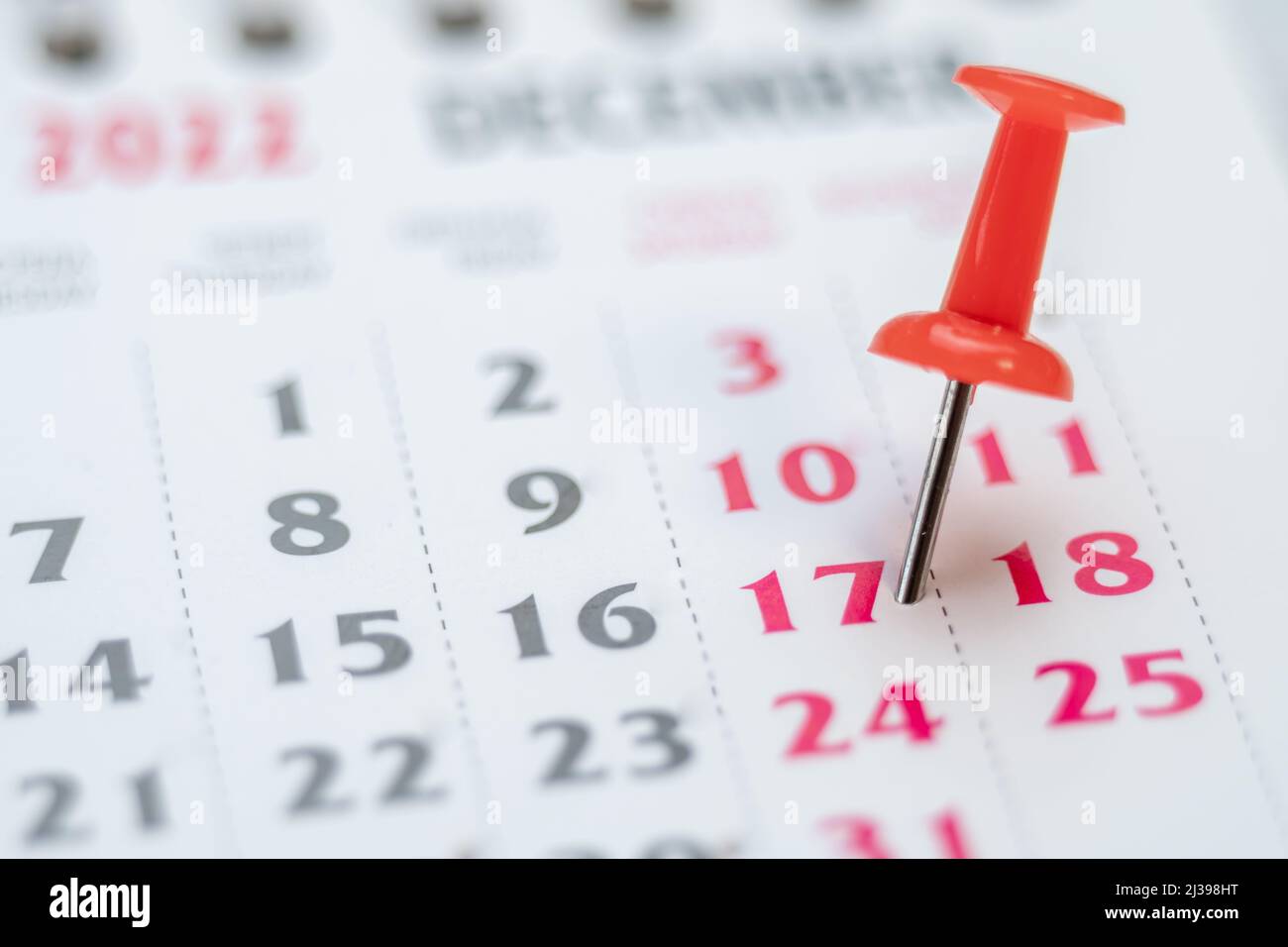Red push pin on calendar 17th day of the month, mark the Event day with ...