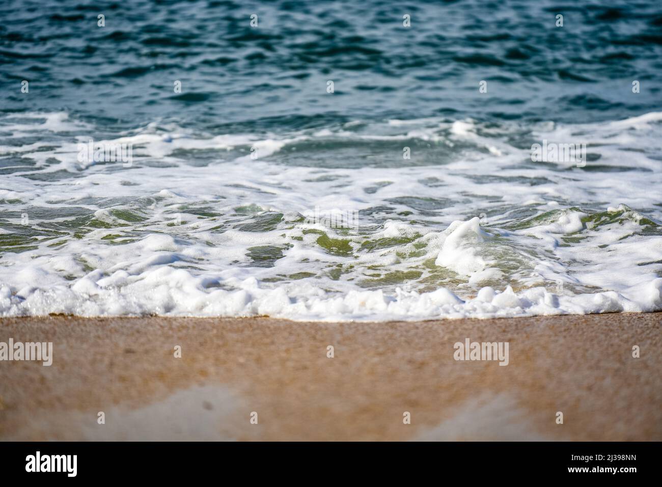 A landscape view of the beach with waves Stock Photo - Alamy