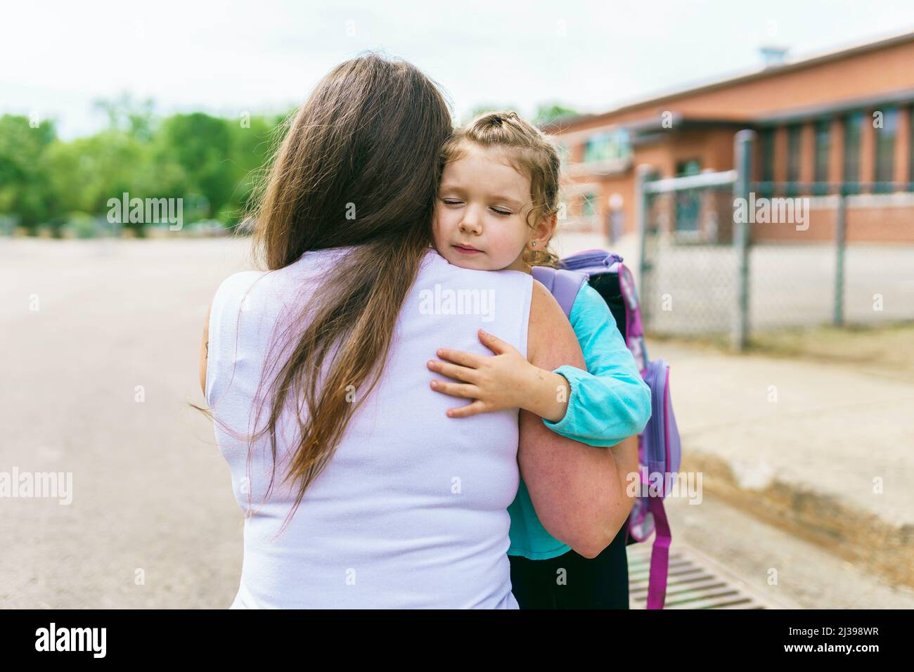 Mother and her daughter to school. Giving a big hug Stock Photo - Alamy