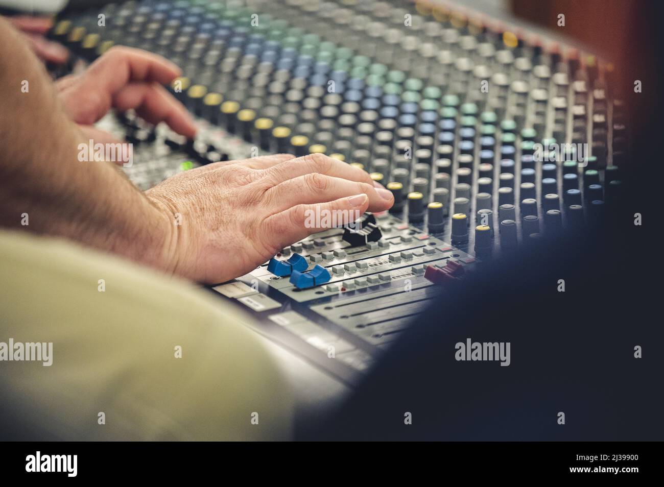 A closeup of a professional sound mixing console for an audio ...