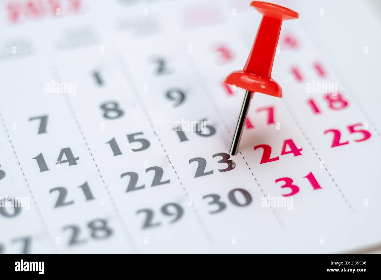 Red push pin on calendar 23th day of the month, mark the Event day with ...