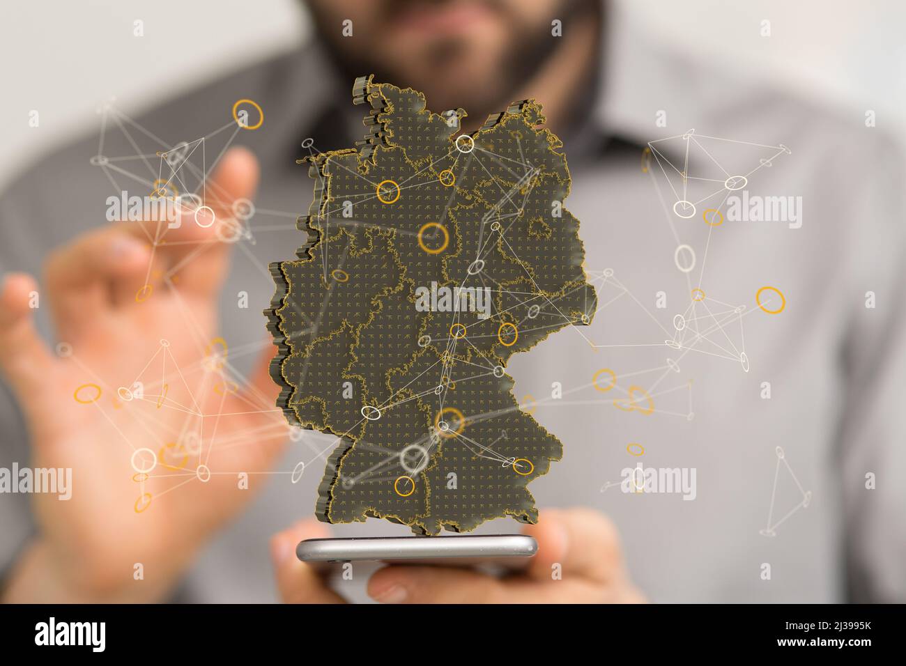 An illustration of a virtual Germany land map digital in hand Stock Photo - Alamy