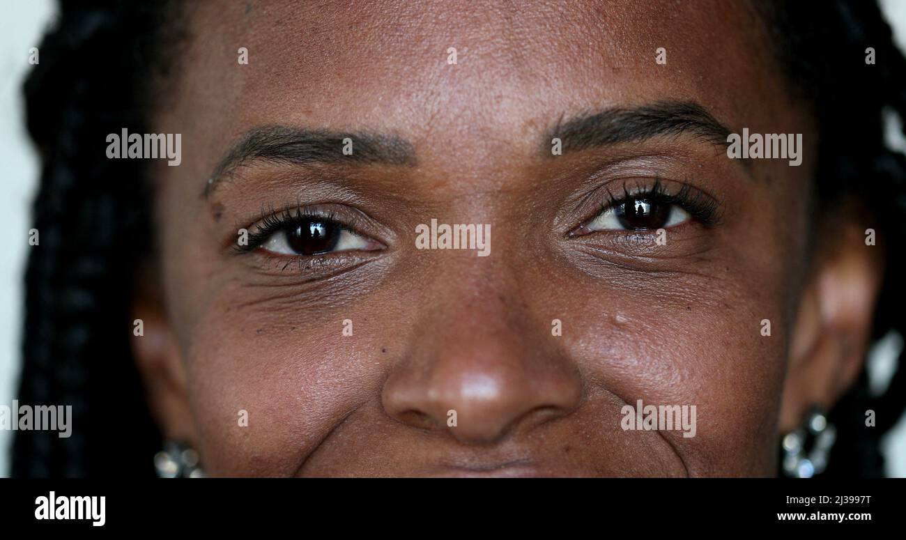 African black woman smiling at camera, macro close-up eyes fce Stock ...