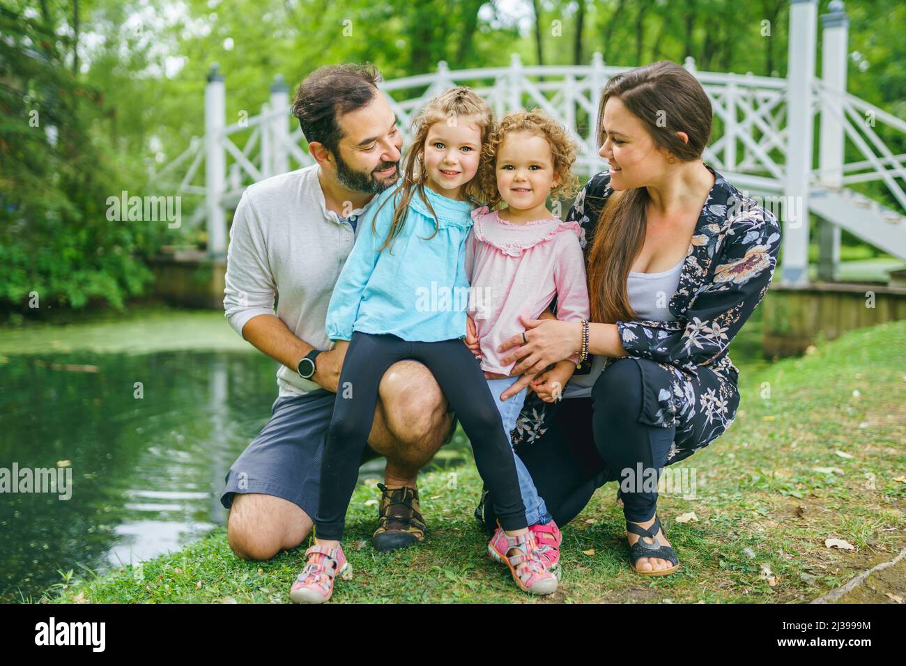 nice family having fun in summer forest Stock Photo - Alamy