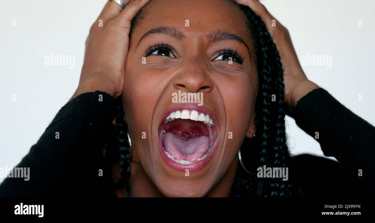 Anxious African girl emotional reaction, black teen woman hitting own ...