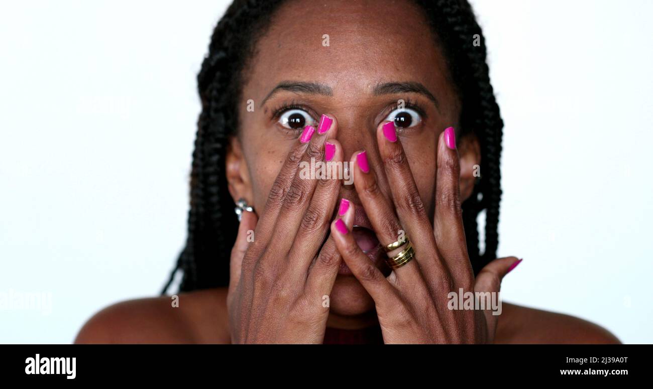 Anxious black African woman reacting to HORRIBLE news with HORROR and ...