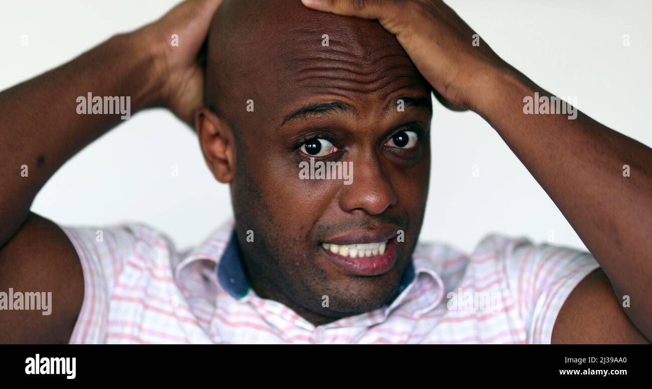 Desperate African man close-up emotional stress reaction Stock Photo ...