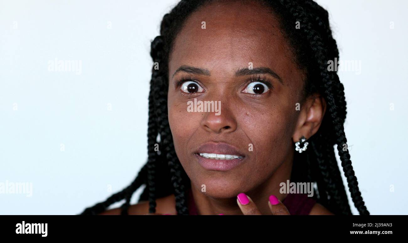 Frightened black African woman exaggerated emotional reaction to news ...