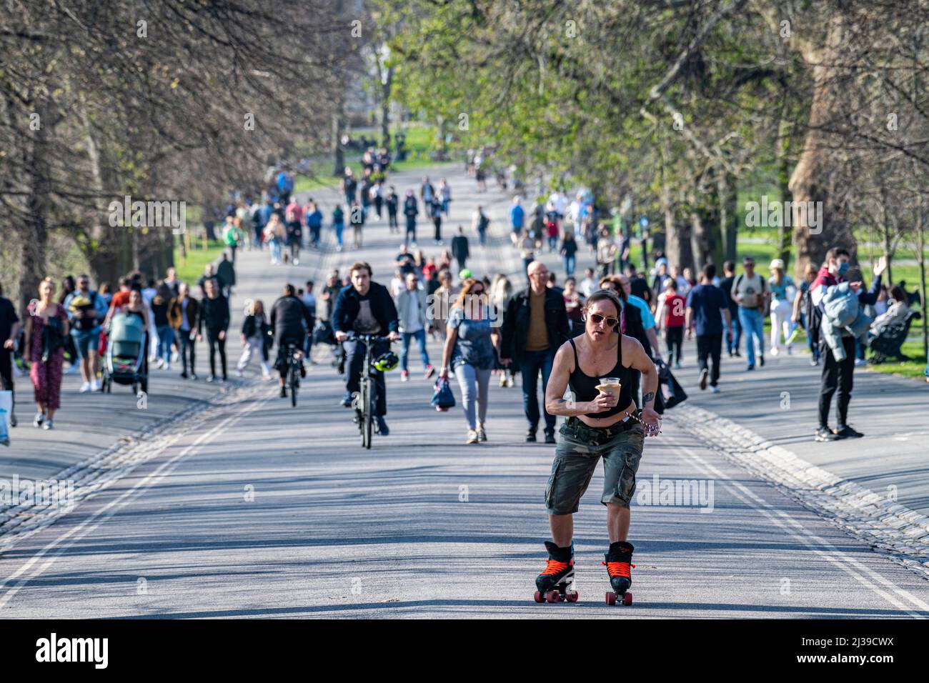 Roller blading in a crowded Greenwich Park on a spring day Stock Photo ...