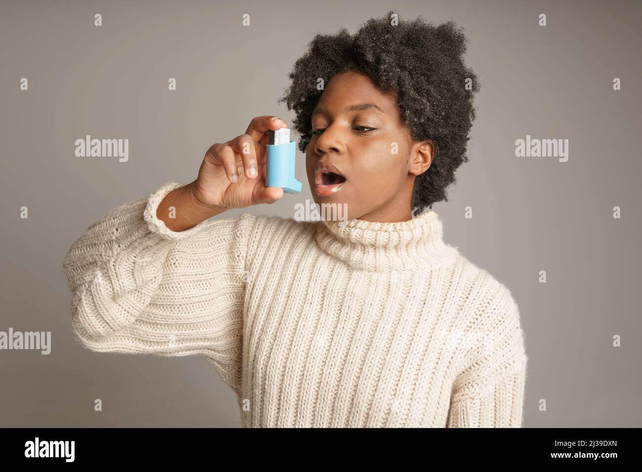 Young African American teen with asthma inhaler Stock Photo - Alamy