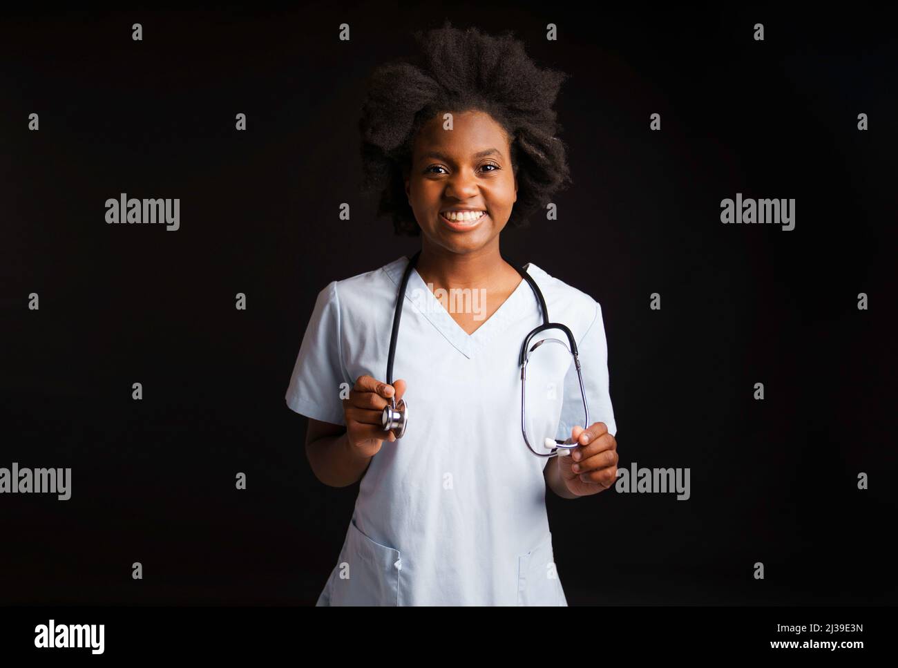 portrait of afro american female nurse on black background Stock Photo ...