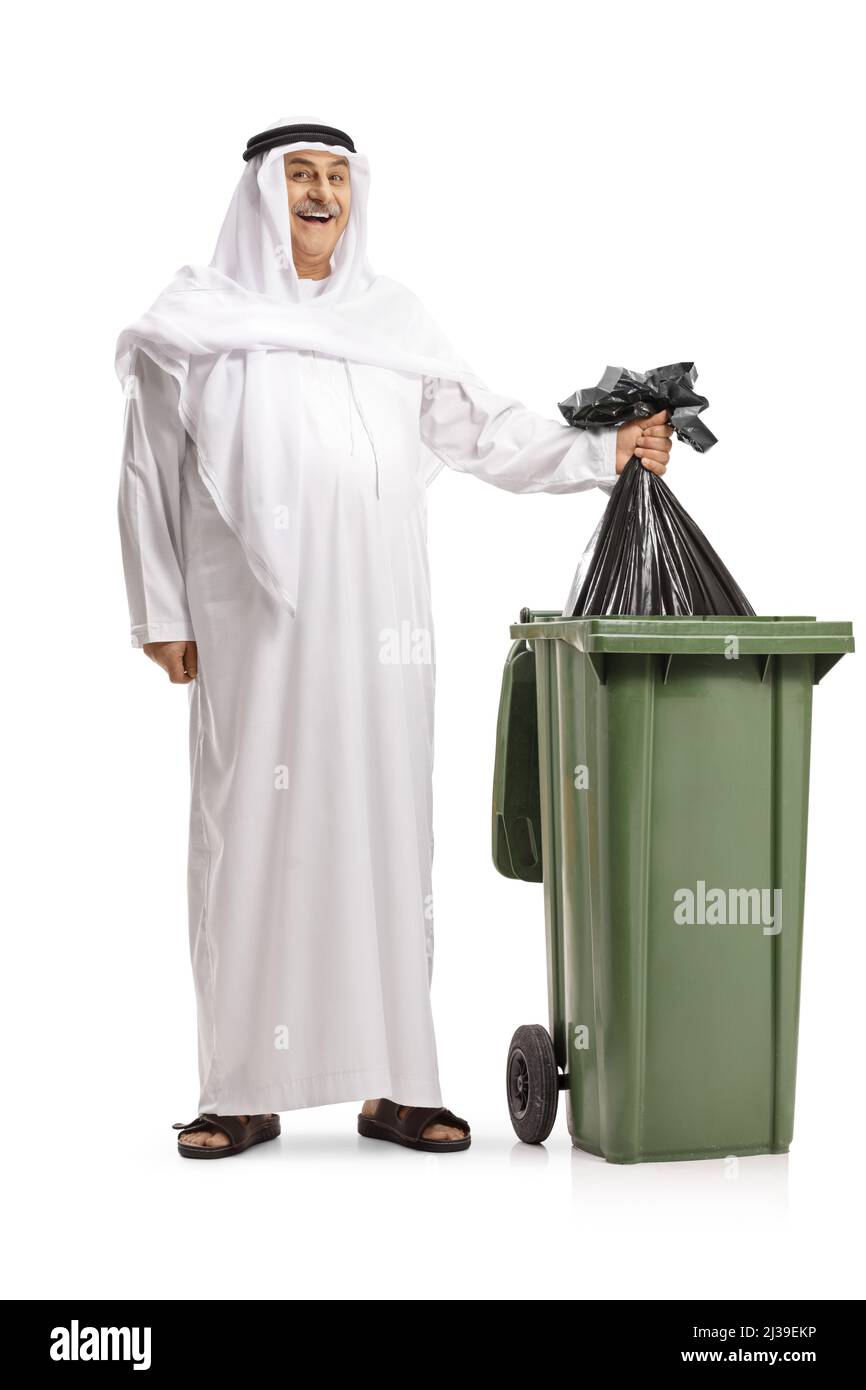 Full length portrait of a happy arab throwing a black plastic bag in a ...