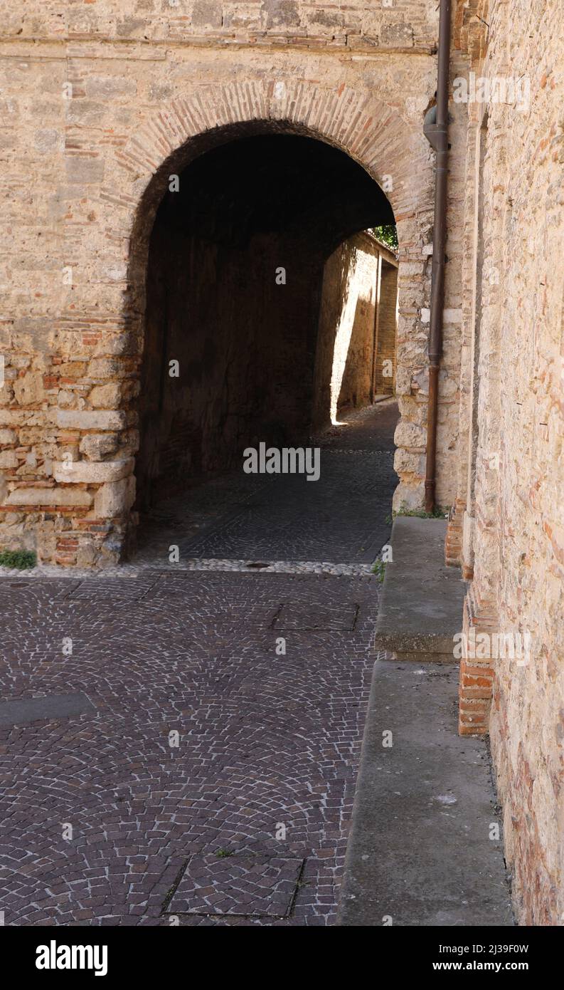 ancient gate of access to the medieval village between the walls of the ...