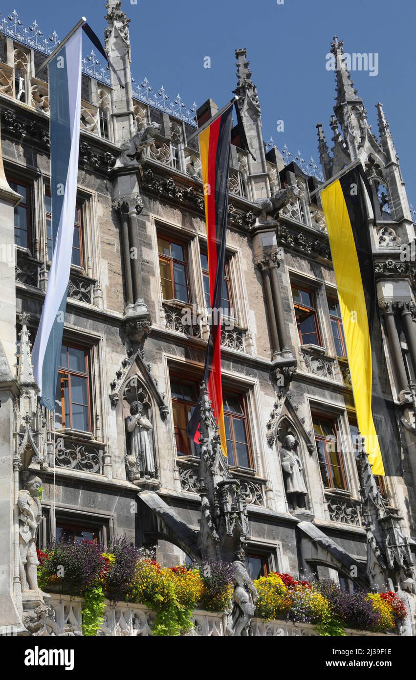 Munich city hall in Germany with three big flags of the nation of the ...