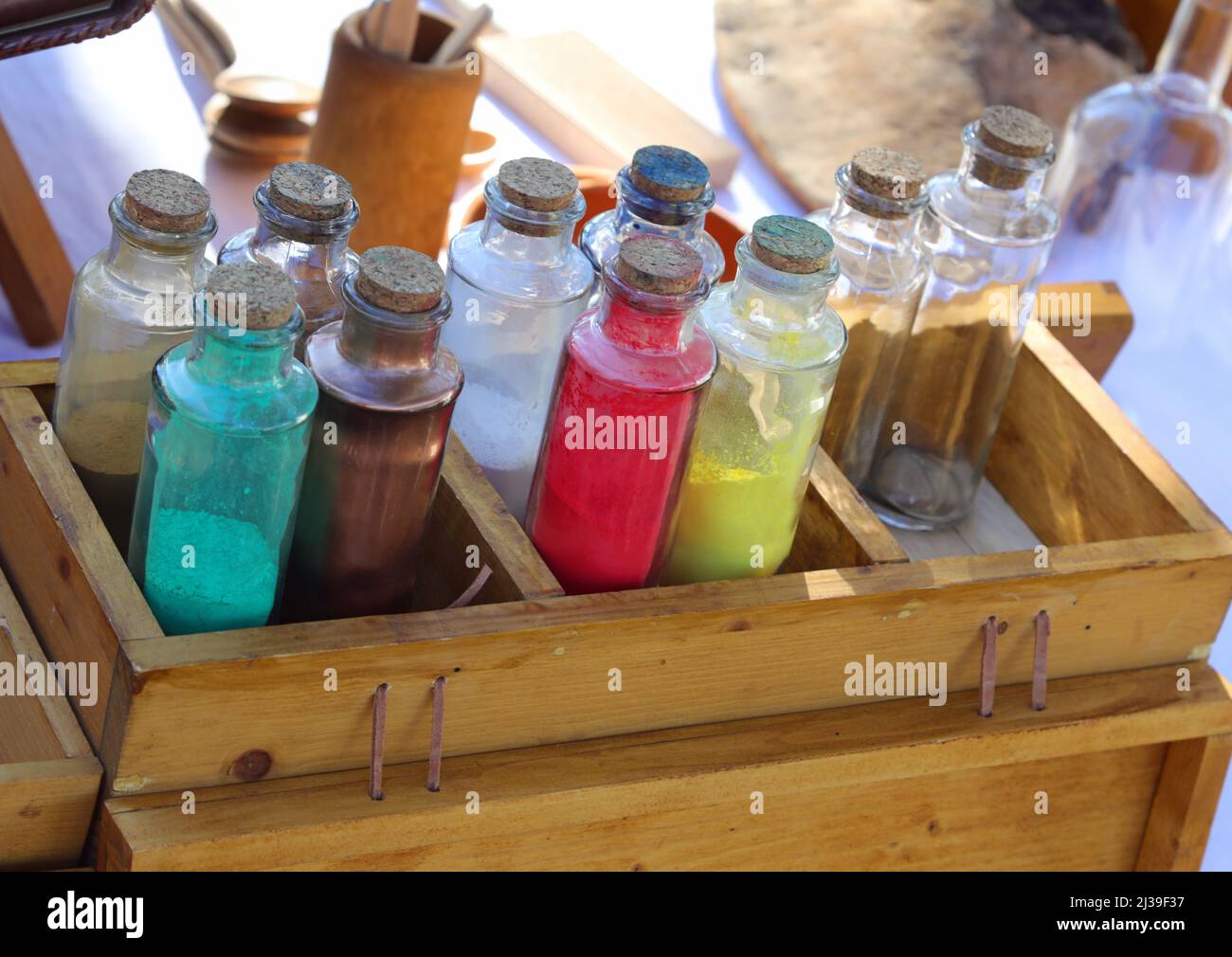 many glass bottles with liquid pigments and dyes used to color fabrics ...