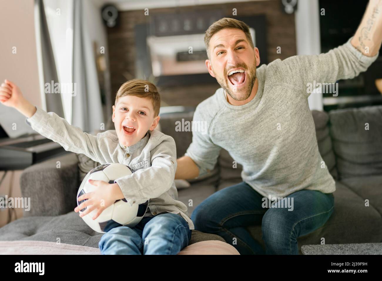 Father and son football fans hi-res stock photography and images - Alamy